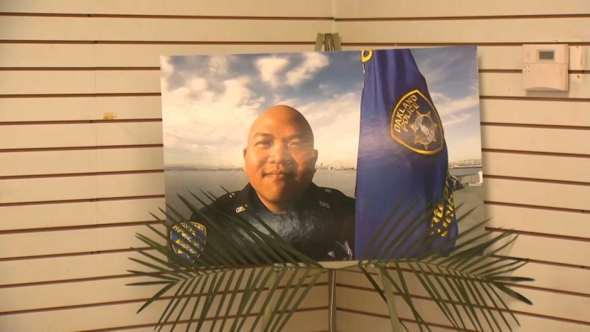 Oakland community to hold vigil for police officer killed in line of ...